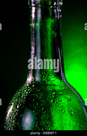 empty wine bottle with drops on a white background Stock Photo - Alamy