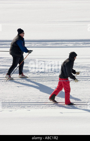 Two people cross country skiing in Utah Stock Photo - Alamy