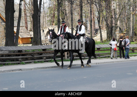 Polish highlanders wearing traditional clothes riding Stock Photo - Alamy
