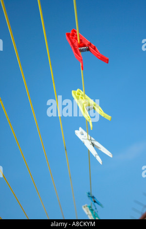 Plastic pegs clipped to a clothes line in an English village Stock ...