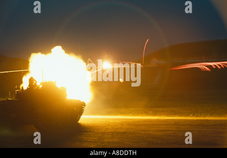 A Challenger tank firing live rounds at the Lulworth Firing Range which ...