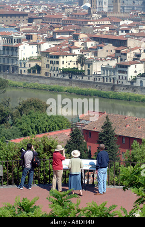 Tourists overlook Florence from the Piazzale Michelangelo Tuscany Italy ...