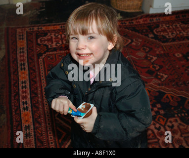 Little Girl Eating A Chocolate Pudding Stock Photo - Alamy