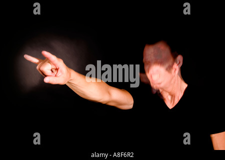 Man making the horn sign of the devil Stock Photo - Alamy