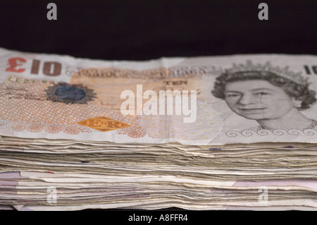 Stack of ten 10 pound notes sterling on a white background - new design ...