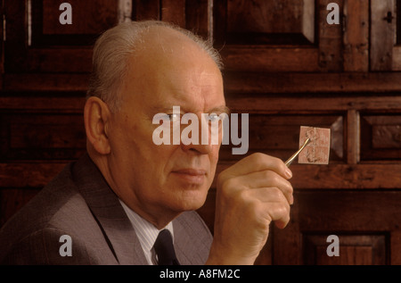 John Marriott stamp collector at his home with a group of 4 rare stamps ...