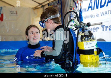 A boy taking scuba diving lessons in the caribbean resort Stock Photo ...