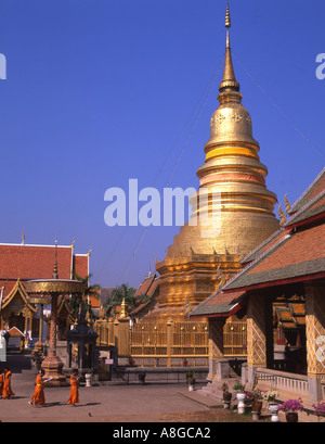 Buddhist monks at Wat Phra That Haripunchai, in the ancient town of Lamphun in Northern Thailand ...