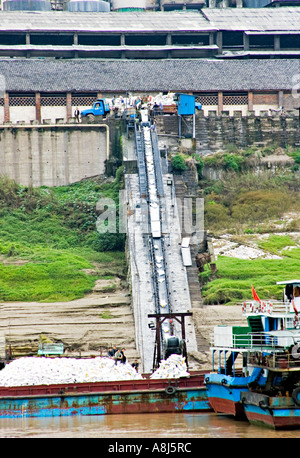 CHINA YANGTZE RIVER Chinese workers load barges with bags of coal from ...