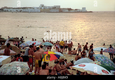 People enjoy a summer evening at the Moretti Club des Pins beach ...