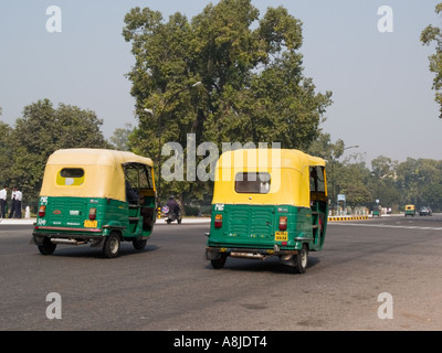 Yellow and green auto rickshaws in Indiya Stock Photo - Alamy