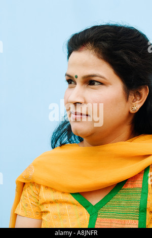 Middle age adult woman wearing winter sweater and chrismat hat over ...