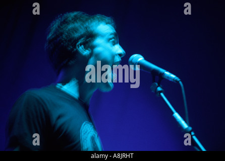 Fran Healy (L) lead singer of Travis talks to bass guitarist Dougie ...