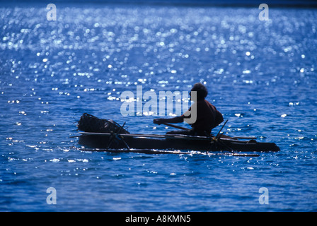 Tongan man paddling traditional wooden handmade fishing canoe Stock ...