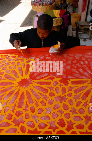 Craftsman painting in souk medina Marrakech Marrakesh Morocco North ...