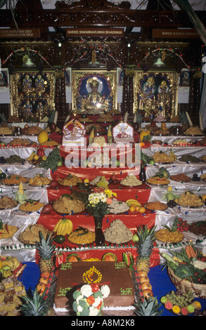 HINDUISM Divali offerings of fruits and sweetmeats on a temple altar ...