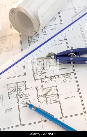 High angle of drafting tools and designing tools placed on a blueprint ...