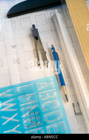 High angle of drafting tools and designing tools placed on a blueprint ...