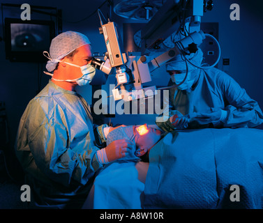 Surgeon undertaking eye surgery detached retina operation Stock Photo ...