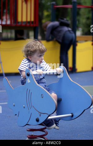 boy aged three in Arnot Park on the climbing frame Stock Photo - Alamy