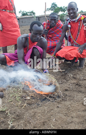 masai tribesman demonstrating traditional fire making Stock Photo - Alamy