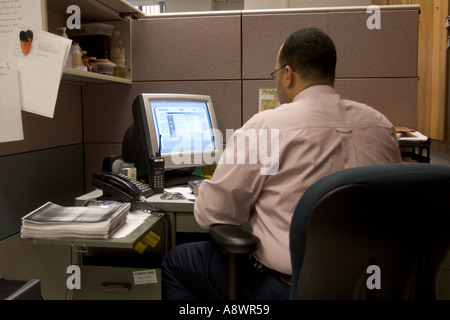 Homicide detective working at desk in police department office. Kansas ...