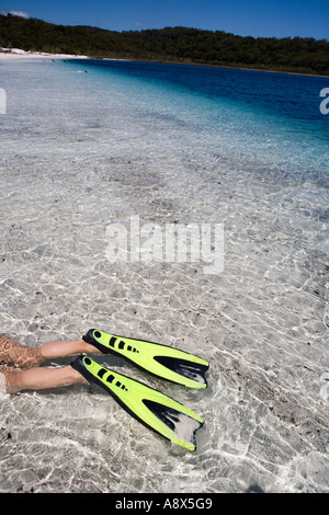 woman legs in flippers at beach sea on background copy space Stock ...