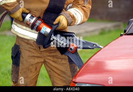 Firefighters cut open a car during a training drill Stock Photo - Alamy