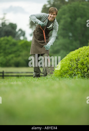 a young happy gardener smiles Stock Photo - Alamy