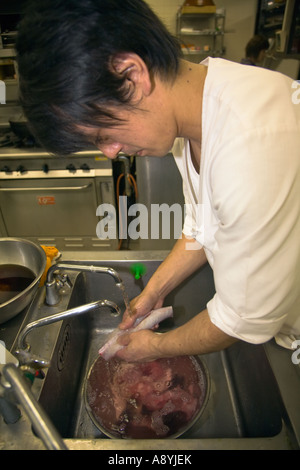 Preparing a Fugu blowfish for sashimi in a Japanese restaurant Stock ...
