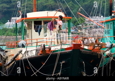 Laundry clothes hanging on a fishing boat Stock Photo - Alamy
