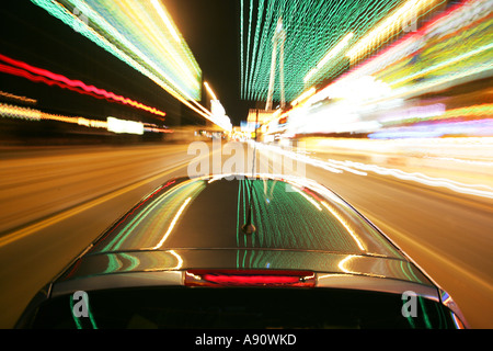 moving car with blur light through city at night Stock Photo - Alamy
