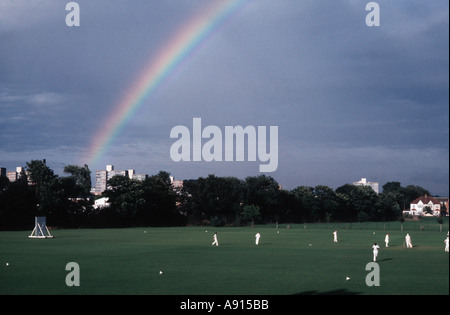 Cricket played under the rainbow Stock Photo - Alamy