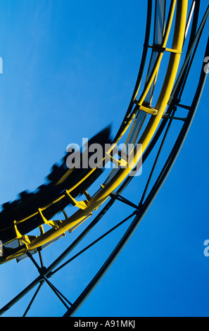 Roller coaster in motion, amusement park at night. Long exposure Stock ...