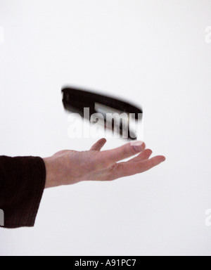 A hand about to grab a flying stapler Stock Photo - Alamy