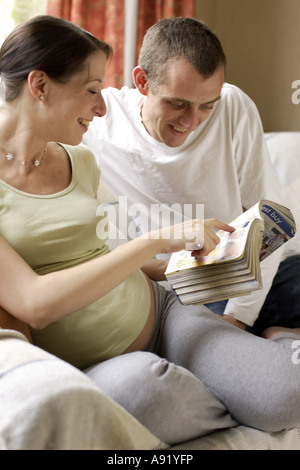 Partner feeling baby kick Stock Photo - Alamy