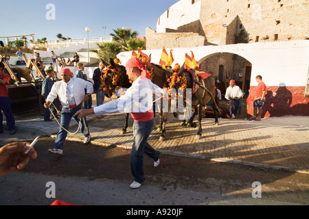 dead bull taken from bullring with horrified spectators and children ...
