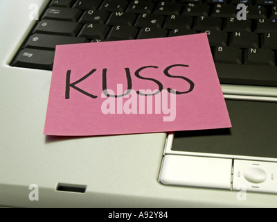 Memo note on notebook, kiss Stock Photo - Alamy