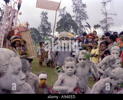 Children dancing as Asaro mudmen Asaroka Eastern Highlands Province ...