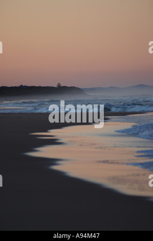 shine sheen of receding wave on beach Stock Photo - Alamy
