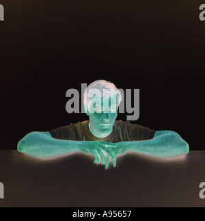 Photograph of man looking over wall Stock Photo - Alamy