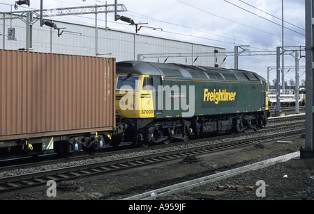 Freightliner class 57 diesel locomotive hauling containers out of the ...