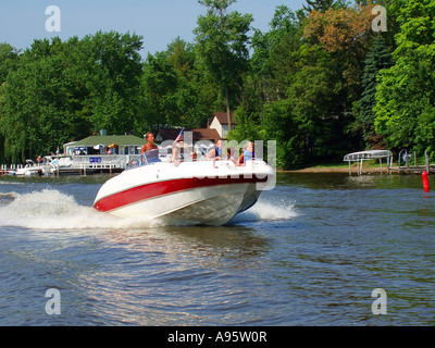 Small fast speedboat, pleasure craft boat with five adult males ...