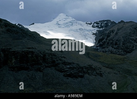 Landscape of rugged Himalayan mountain range against a deep blue sky ...
