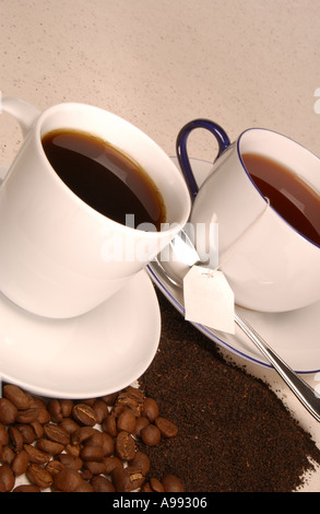 Cup of coffee with beans and leaves on light background Stock Photo - Alamy
