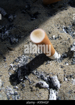 cigarette stubs in sand Stock Photo - Alamy
