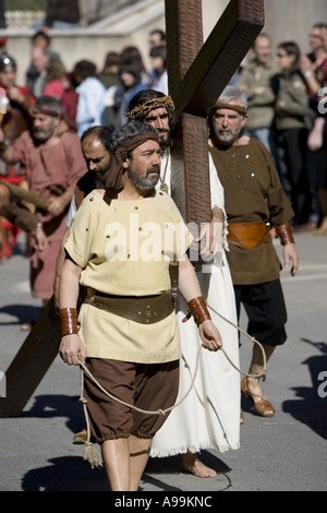 Actor playing Jesus Christ with Roman soldiers during the Passion play ...