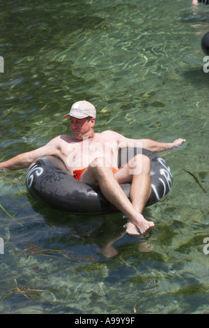 Man floating in inner tube in ocean Stock Photo - Alamy