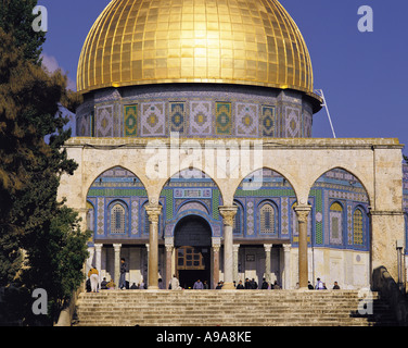 Close-up of a golden mosque dome with stainless steel spire naturally ...