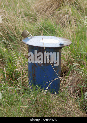 Bore hole or borehole inspection cover in a field Stock Photo - Alamy